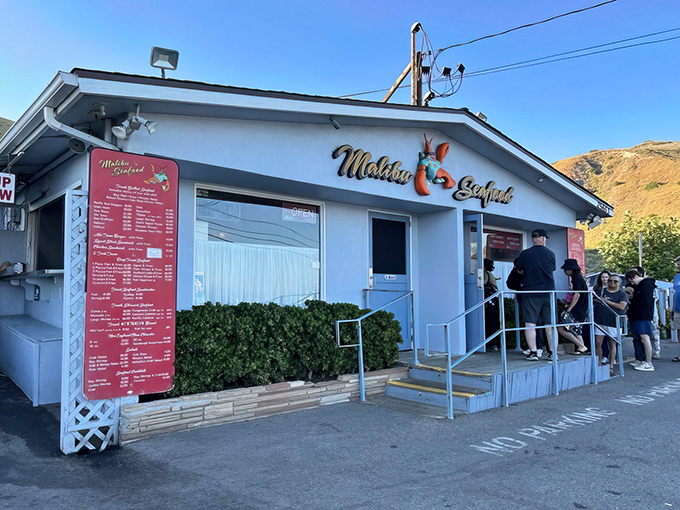 The blue-and-red facade of Malibu Seafood stands like a beacon for hungry travelers along PCH, promising seafood salvation just steps from the Pacific.