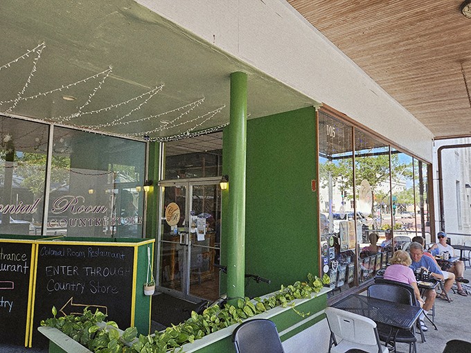 That distinctive green entrance column isn't just architectural flair&mdash;it's a beacon guiding hungry travelers to breakfast nirvana since before Instagram made food photos a thing.
