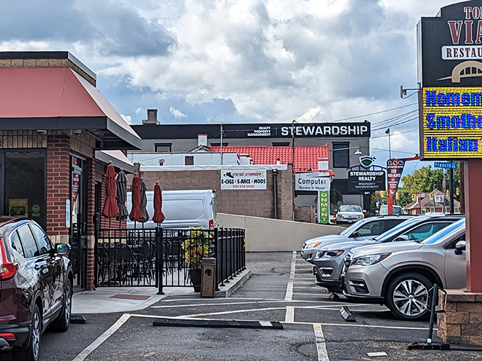 That outdoor patio beckons like an oasis for summer brunchers. The red umbrellas practically whisper, "Coffee refills and gossip welcome here."