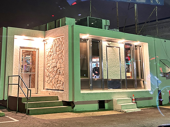 At night, the Llanerch transforms into a glowing sanctuary for late-night diners, its windows promising warmth and satisfaction inside.