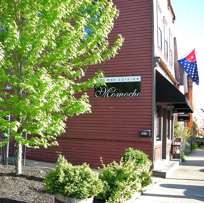 The salmon-colored exterior of Momocho stands like a delicious secret on Cleveland's Bridge Avenue, beckoning hungry explorers with understated charm.