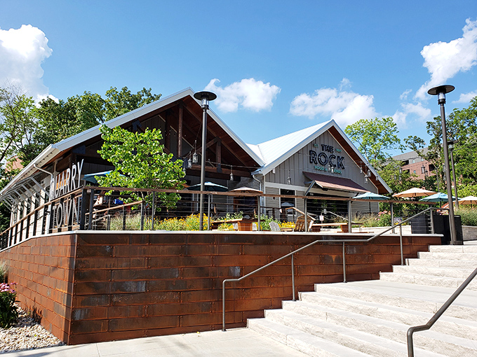 The Rock's striking timber-framed exterior rises like a culinary beacon in Springfield, inviting hungry travelers to climb those steps toward flavor paradise.