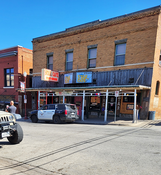 The historic brick facade of Star Cafe stands proudly in Fort Worth, a time capsule of Texas dining that's been serving up satisfaction longer than most Texans have owned boots.