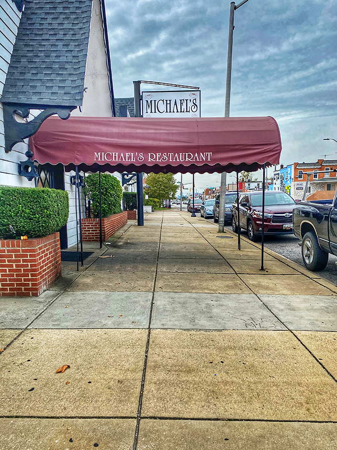 The burgundy awning of Michael's stands like a culinary lighthouse on Eastern Avenue, beckoning hungry travelers with promises of carnivorous delights within.