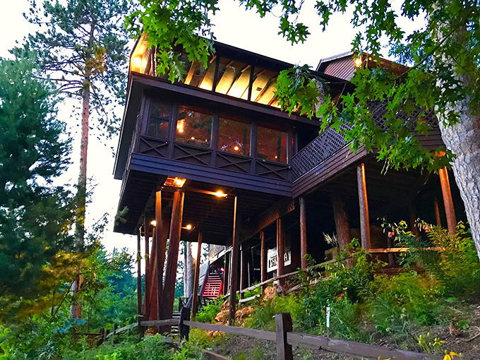 Perched among towering pines like a woodland treehouse for grown-ups, Ishnala's exterior promises adventure before you even step inside.