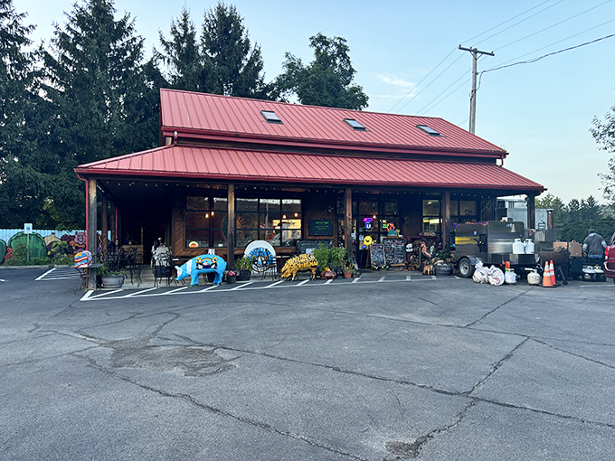 The red-roofed barbecue sanctuary beckons with its rustic charm, complete with a whimsical blue pig statue standing guard at the entrance.