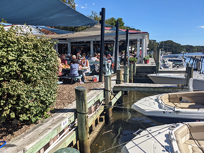 Paradise found! The Point Crab House perches right on Mill Creek like a seabird ready to dive, with boats bobbing nearby and shade sails fluttering in the breeze.