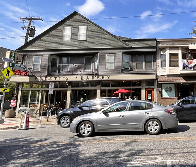 Red umbrellas brighten the exterior of this Little Italy landmark, where a steady stream of cars signals just how popular it is with pastry lovers.