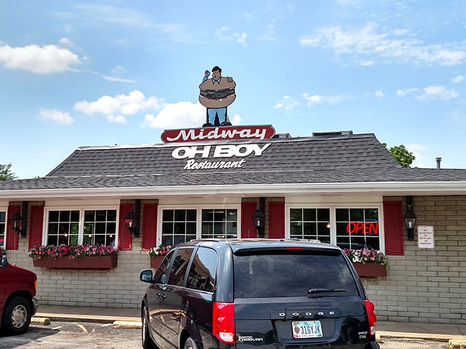 The iconic Midway Oh Boy sign stands proudly atop this Elyria institution, where the cartoon burger man has been welcoming hungry patrons for generations.
