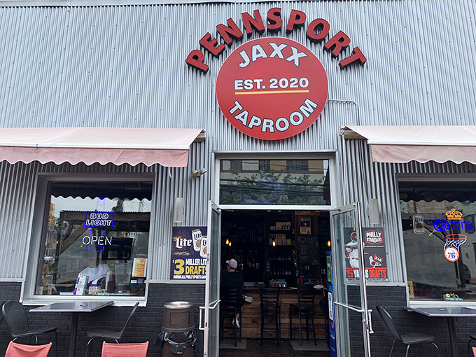 The unassuming black exterior of Jaxx Taproom stands like a culinary speakeasy, its red sign a beacon for sandwich seekers throughout Pennsylvania.