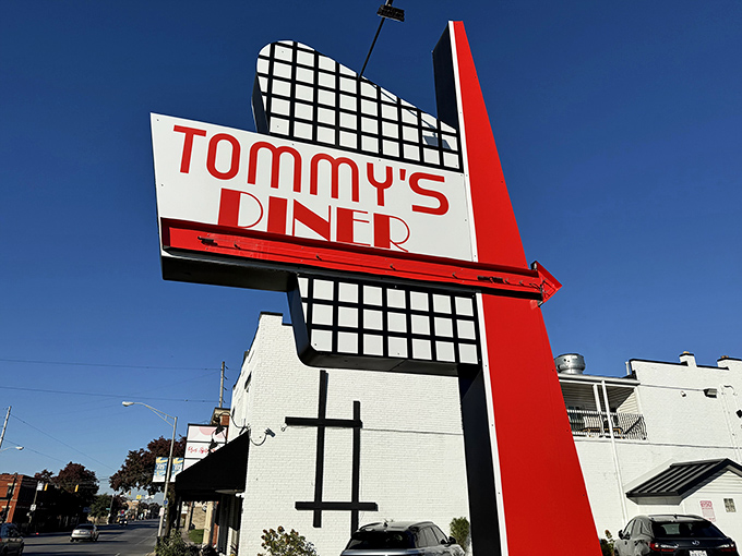 The iconic Tommy's Diner sign stands tall against the Columbus sky, a beacon of breakfast hope for hungry souls wandering West Broad Street.