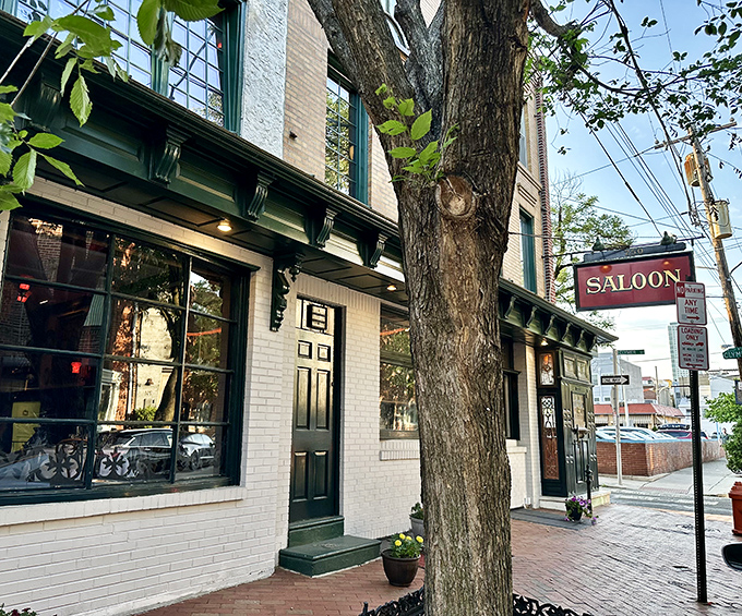 The Saloon's classic white brick exterior with its distinctive green trim feels like stepping into Philadelphia's storied past, where culinary treasures await behind that unassuming door.
