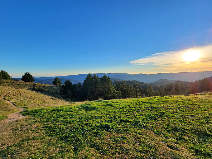 Nature's own IMAX theater unfolds at sunset, where rolling hills meet sky in a display that makes smartphone wallpapers look downright inadequate.