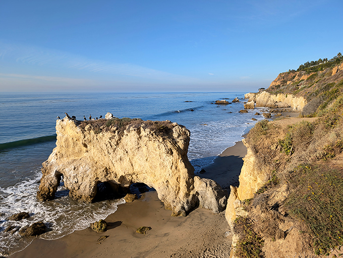Nature's own sculpture garden where golden cliffs meet azure waters. El Matador's iconic rock formations stand like sentinels guarding California's most photogenic shoreline.