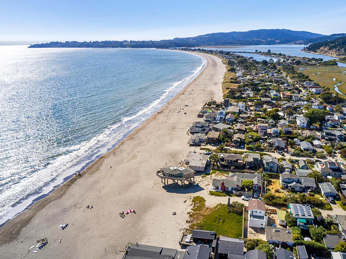 Stinson Beach stretches out like nature's welcome mat, where the Pacific meets pristine shoreline and houses perch like spectators to an endless ocean show.