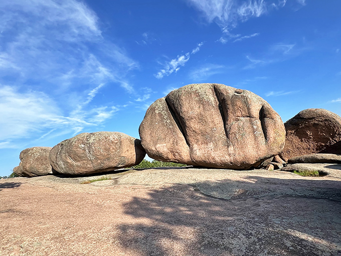 Nature's own game of Jenga! These massive pink granite boulders have stood in perfect balance for over a billion years, defying both gravity and imagination.