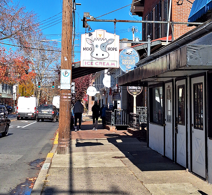 The whimsical cow sign hanging above Moo Hope Ice Cream promises dairy delights that'll make you forget every diet resolution you've ever made.