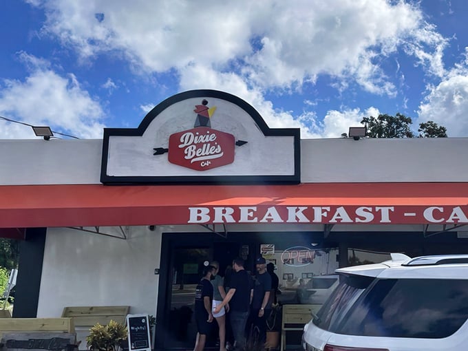 The iconic Dixie Belle's Cafe storefront beckons with its cheerful red awning and promise of breakfast bliss. Like finding a $20 bill in your winter coat pocket &ndash; unexpected joy awaits.