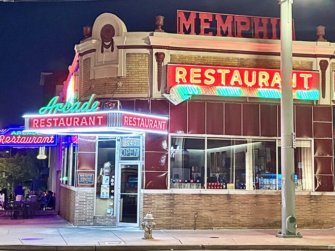 The iconic corner facade of The Arcade Restaurant stands as Memphis' oldest cafe, its vintage neon sign beckoning hungry travelers like a culinary lighthouse.