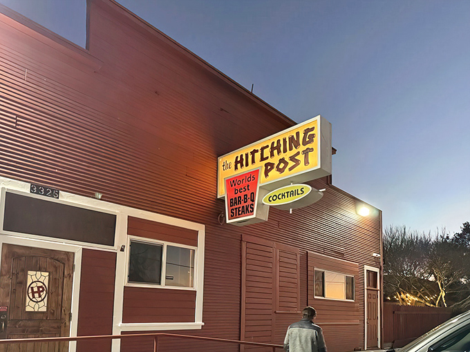 The iconic yellow sign beckons hungry travelers like a beacon in the night. This unassuming exterior houses culinary magic that's been drawing pilgrims for generations.