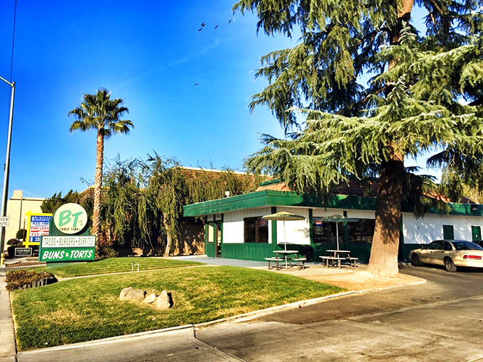 The classic green-roofed oasis of B T's stands proudly against the California sky, promising culinary treasures that belie its humble exterior.