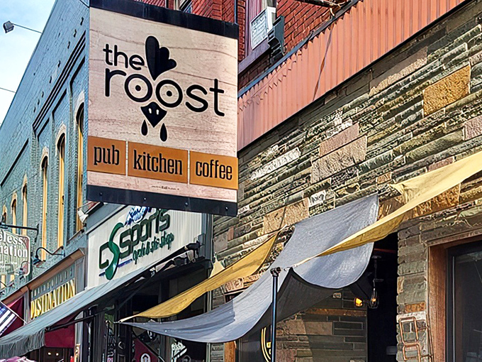 The Roost's charming storefront beckons from Wellsboro's historic Main Street, promising triple delights as pub, kitchen, and coffee shop all in one inviting package.