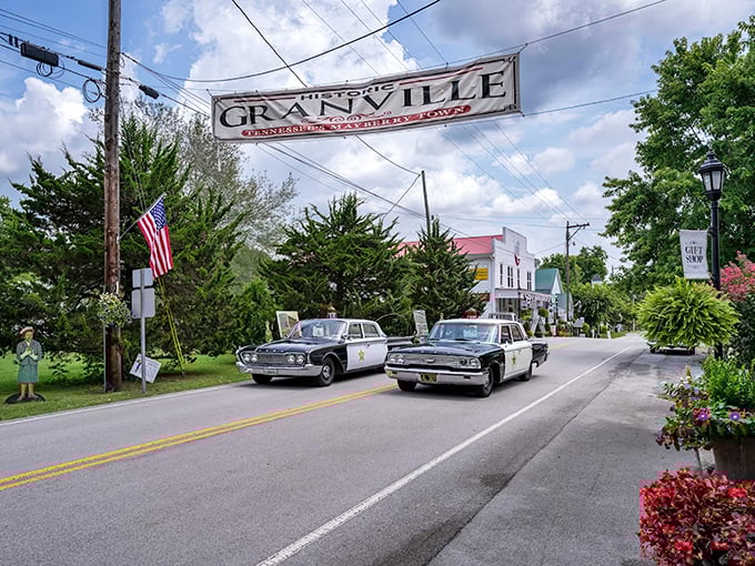 The iconic Granville banner welcomes visitors with vintage police cars parading beneath &ndash; small-town Americana that's not staged for tourists but genuinely lived.