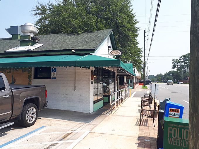 Metro Diner's iconic green awning beckons from Hendricks Avenue like a culinary lighthouse guiding hungry souls to breakfast paradise.