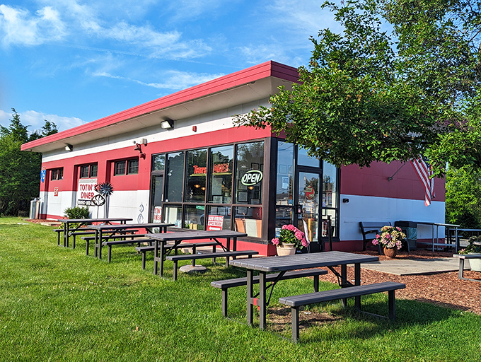 The classic red and white exterior of Totin's Diner stands like a beacon of breakfast hope. Picnic tables invite you to enjoy Pennsylvania sunshine with your morning feast.