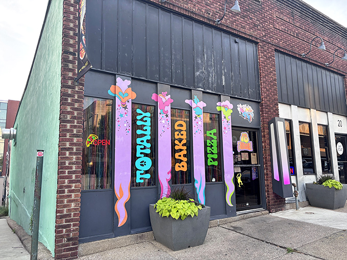The psychedelic storefront of Totally Baked Pizza looks like what would happen if the 1970s and a box of crayons had a beautiful baby together.