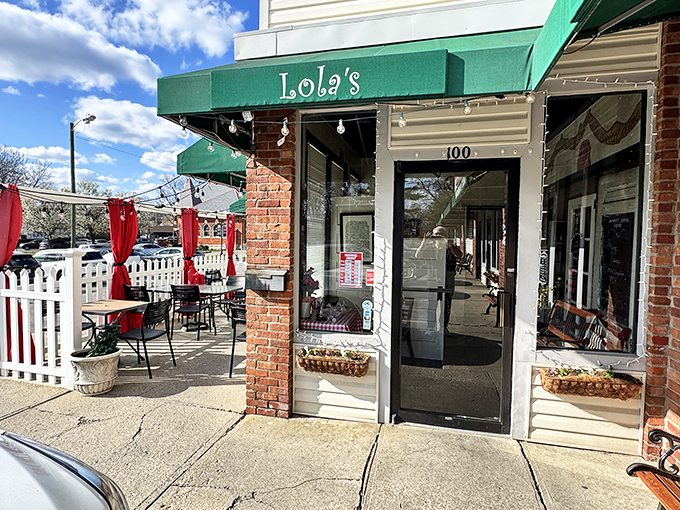 Green awnings and brick charm make this Columbus corner feel like a neighborhood secret worth discovering.