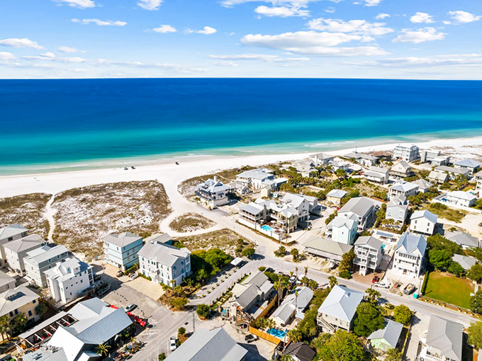 Aerial paradise: Where sugar-white sands meet emerald waters, Grayton Beach's low-rise charm proves sometimes the best views aren't from high-rises but from keeping things beautifully simple.