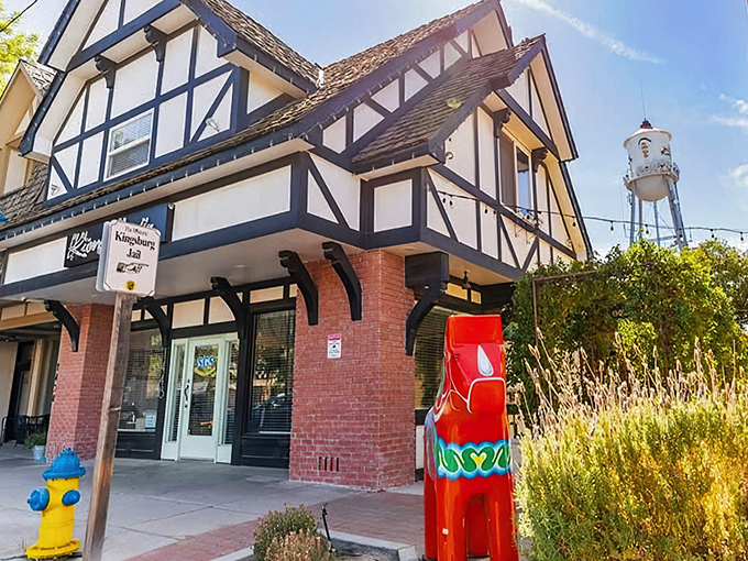Tudor-style buildings with distinctive red Dala horses stand as charming sentinels of Kingsburg's Swedish heritage. Even the fire hydrants dress for the occasion!