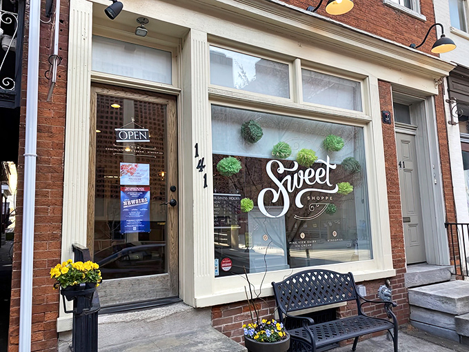 That classic red brick charm practically whispers "come inside for something extraordinary" before you even reach the door.