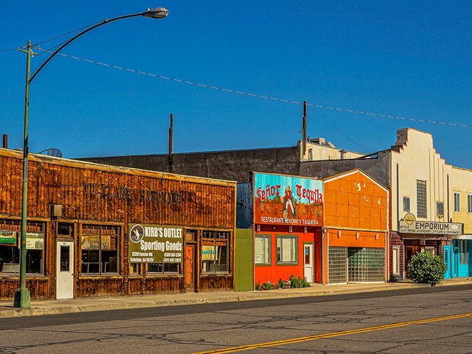 Main Street's colorful storefronts tell a story of small-town resilience, where your dollar stretches further than your average yoga enthusiast.