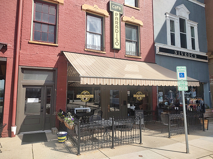 The charming brick fa&ccedil;ade of Caf&eacute; Paradiso brings a touch of European elegance to downtown Urbana, complete with inviting outdoor seating perfect for people-watching.