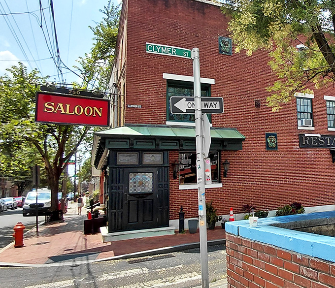 The Saloon's classic white brick exterior with its distinctive green trim feels like stepping into Philadelphia's storied past, where culinary treasures await behind that unassuming door.