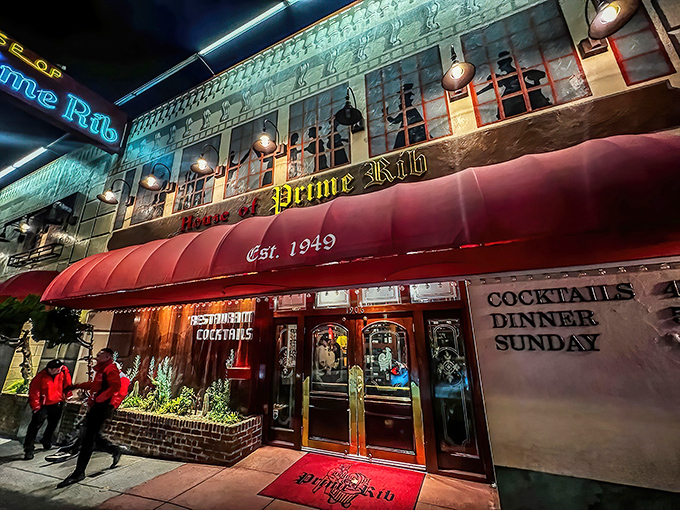 The iconic red awning and neon sign of House of Prime Rib stand as a beacon for meat lovers on Van Ness Avenue, promising carnivorous delights within.