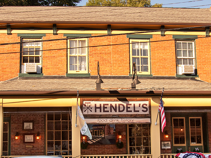 Brick, yellow trim, and those inviting green awnings – Hendel's exterior is like a warm hug in architectural form, beckoning hungry travelers to step inside.