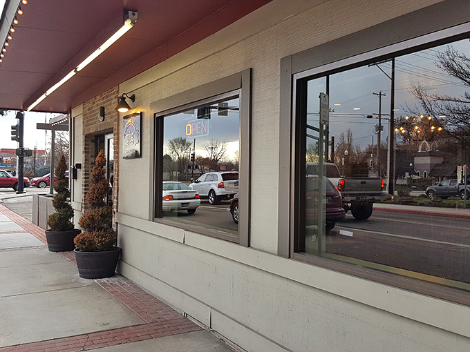 As evening approaches, Bodacious Pig's welcoming glow beckons hungry travelers. That neon "OPEN" sign might as well say "Salvation for empty stomachs" to BBQ pilgrims.