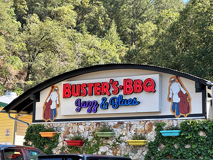 Stone walls draped with ivy frame the bold red "BUSTER'S BBQ" sign &ndash; a siren call to barbecue pilgrims in wine country's unexpected smoke sanctuary.