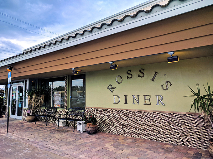 The unassuming exterior of Rossi's Diner proves once again that culinary treasures often hide behind modest facades. Florida sunshine and comfort food await.