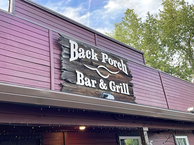 Another angle of the inviting facade, where the wooden sign serves as a beacon for BBQ pilgrims seeking smoky salvation in Jacksonville.
