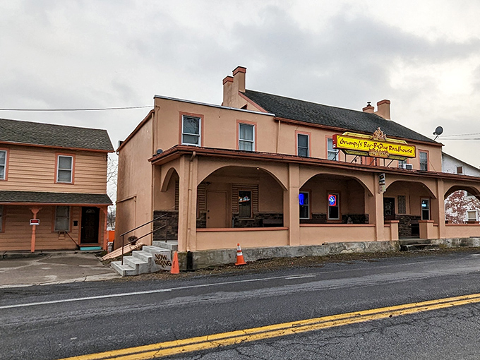 With its peach-colored walls and flame-kissed sign, Grumpy&rsquo;s stands as a true barbecue beacon&mdash;no frills, just smoky goodness that speaks for itself.