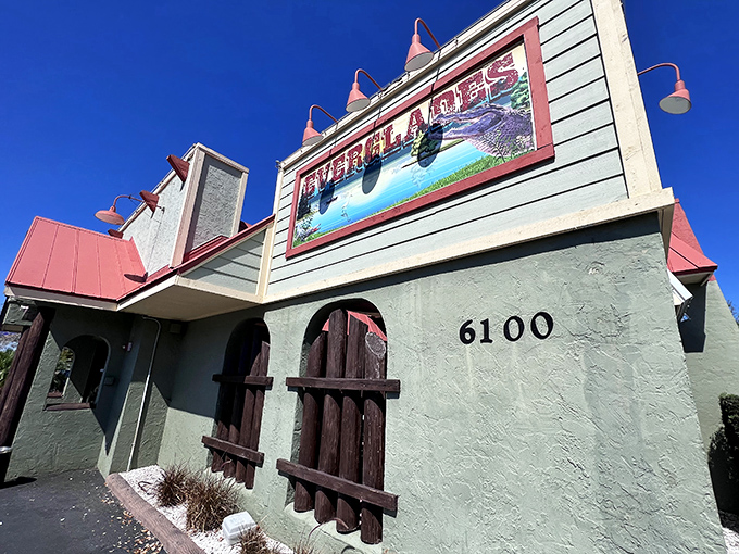The turquoise blue exterior with coral roof isn't just Florida architecture&mdash;it's a promise of the coastal flavor fiesta waiting inside.
