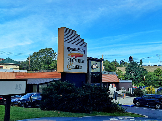 The iconic Wyomissing Restaurant & Bakery sign welcomes hungry travelers to Pennsylvania's beloved all-you-can-eat paradise under clear blue skies.