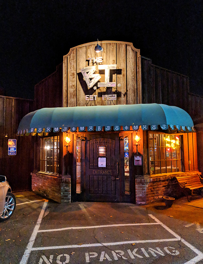 "The BI" glows like a beacon of deliciousness against the night sky, promising treasures within.