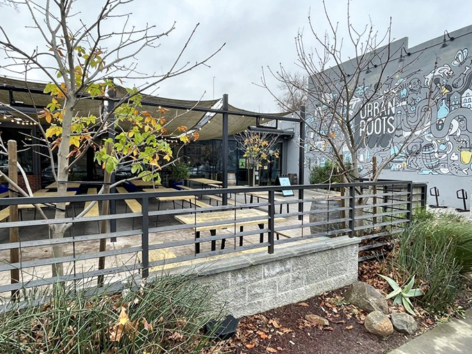 A colorful mural greets visitors, transforming an ordinary wall into a playful canvas that hints at the creative spirit inside.