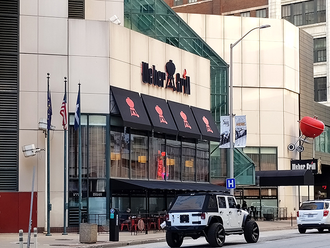 The unmistakable Weber Grill Restaurant facade in downtown Indianapolis, where that giant red kettle isn't just decoration&mdash;it's a promise of what awaits inside.