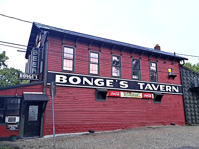 The unassuming burgundy exterior of Bonge's Tavern stands like a culinary lighthouse in the Indiana countryside, beckoning hungry travelers from miles around.